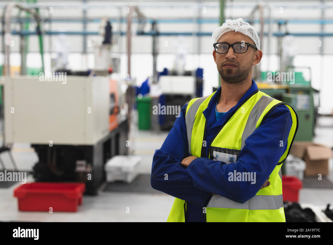Portrait of a male factory worker in a factory warehouse Stock Photo ...