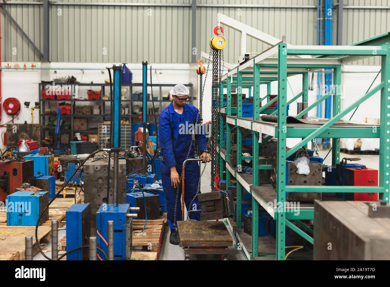 Male factory worker in a factory warehouse Stock Photo - Alamy