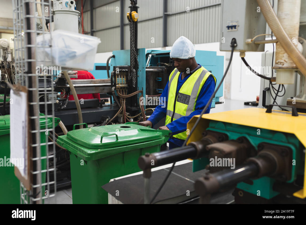 Male factory worker in a factory warehouse Stock Photo - Alamy