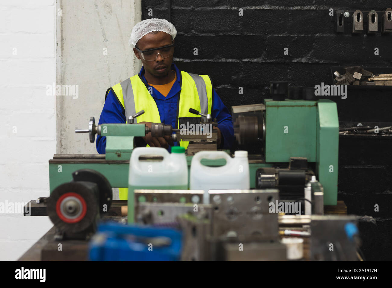 Male factory worker in the workshop at a factory Stock Photo - Alamy