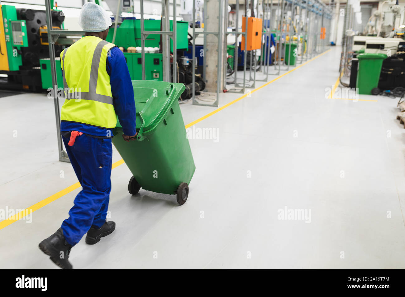 Male factory worker in a factory warehouse Stock Photo - Alamy