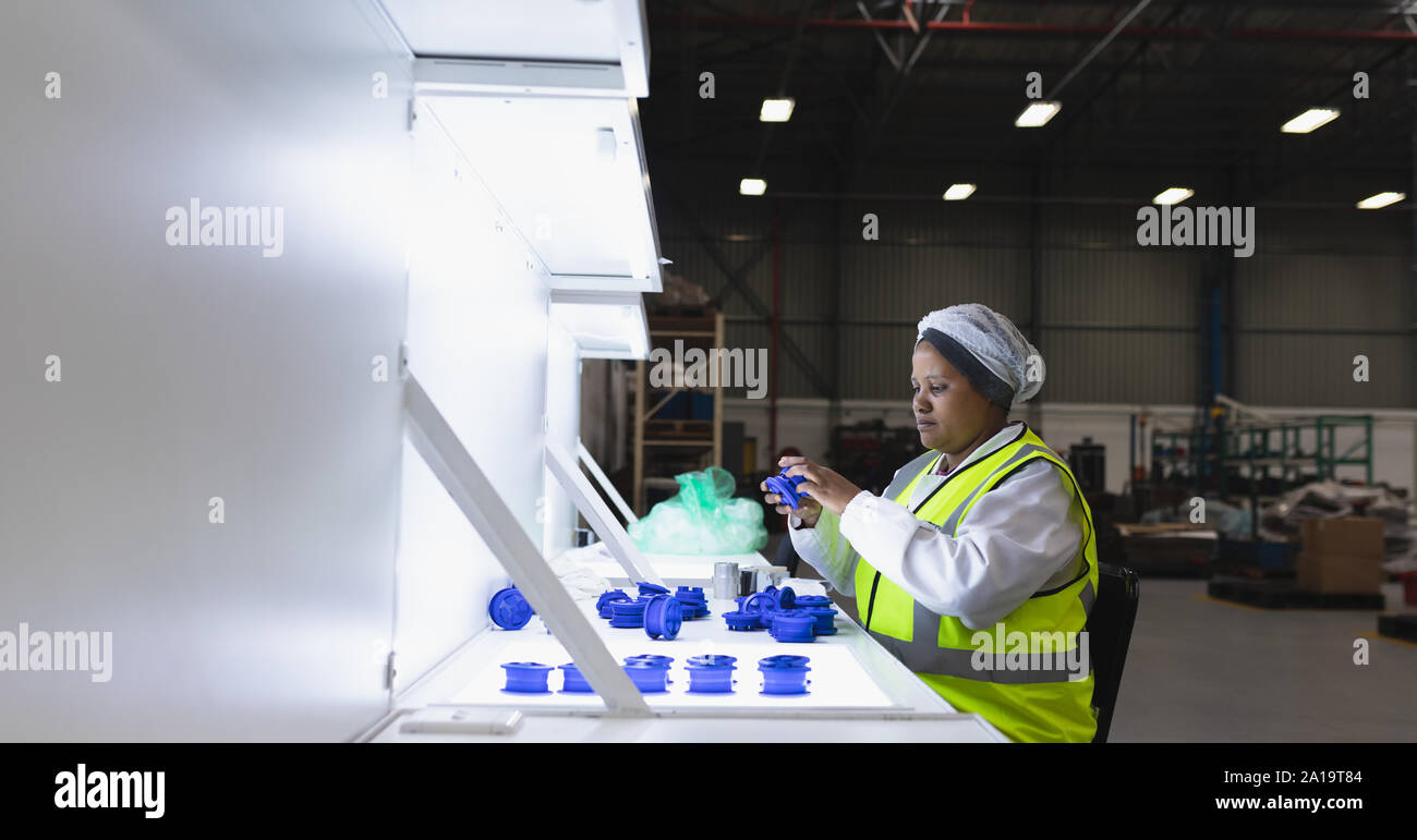 Female factory worker at a factory warehouse Stock Photo - Alamy