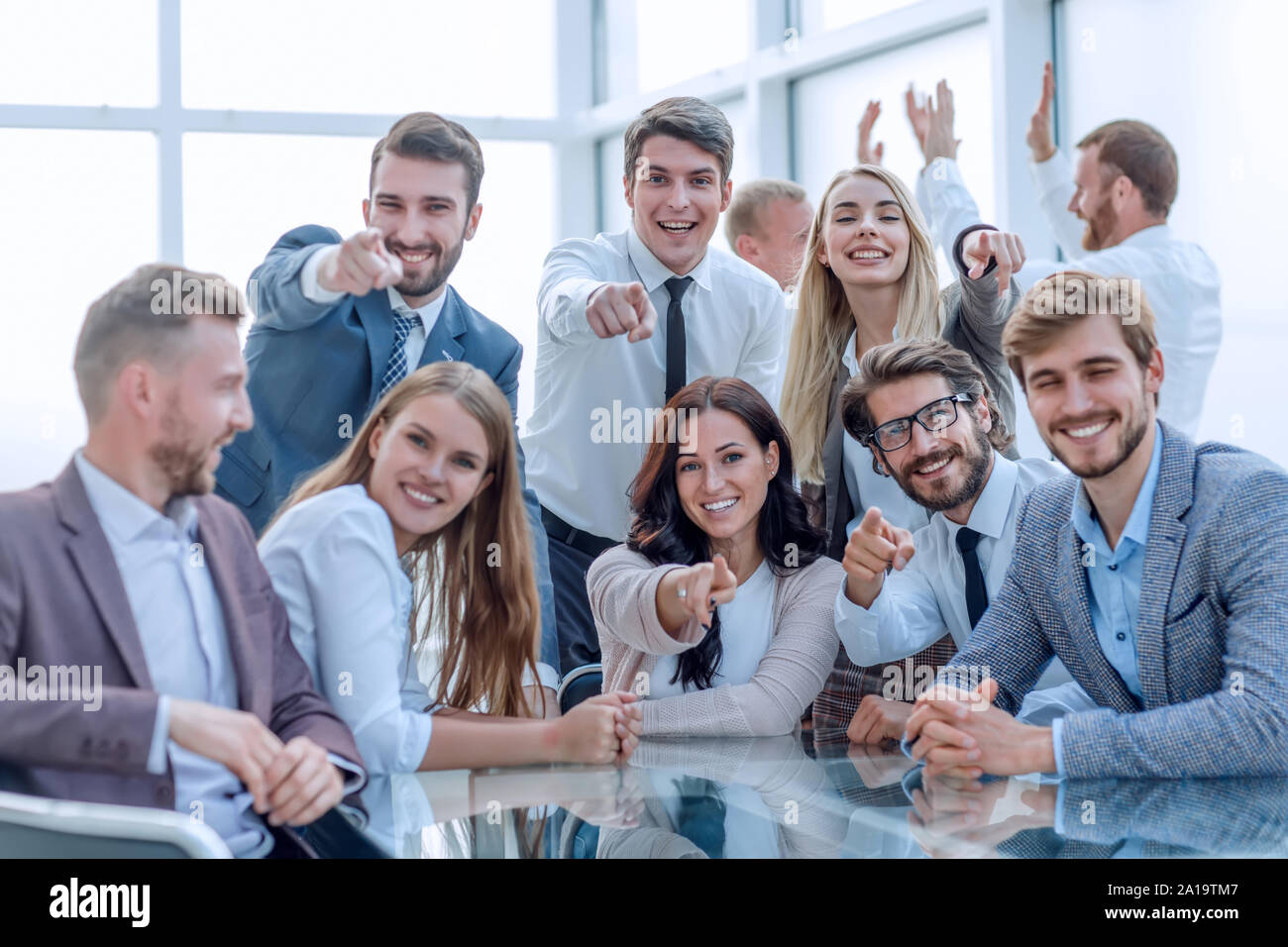 group of young employees are pointing at you Stock Photo - Alamy