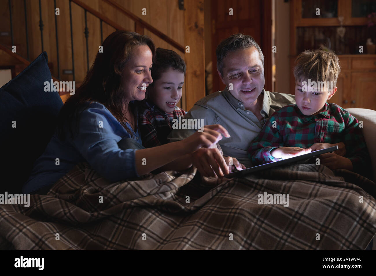 Happy family interacting using hi-res stock photography and images - Alamy