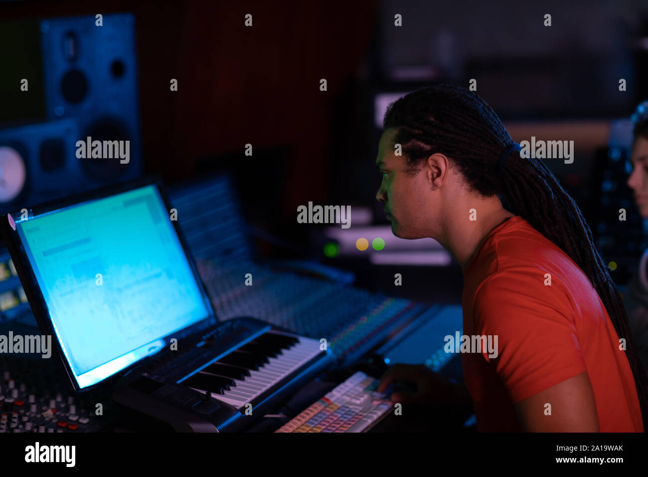 Sound engineer using mixing desk hi-res stock photography and images ...
