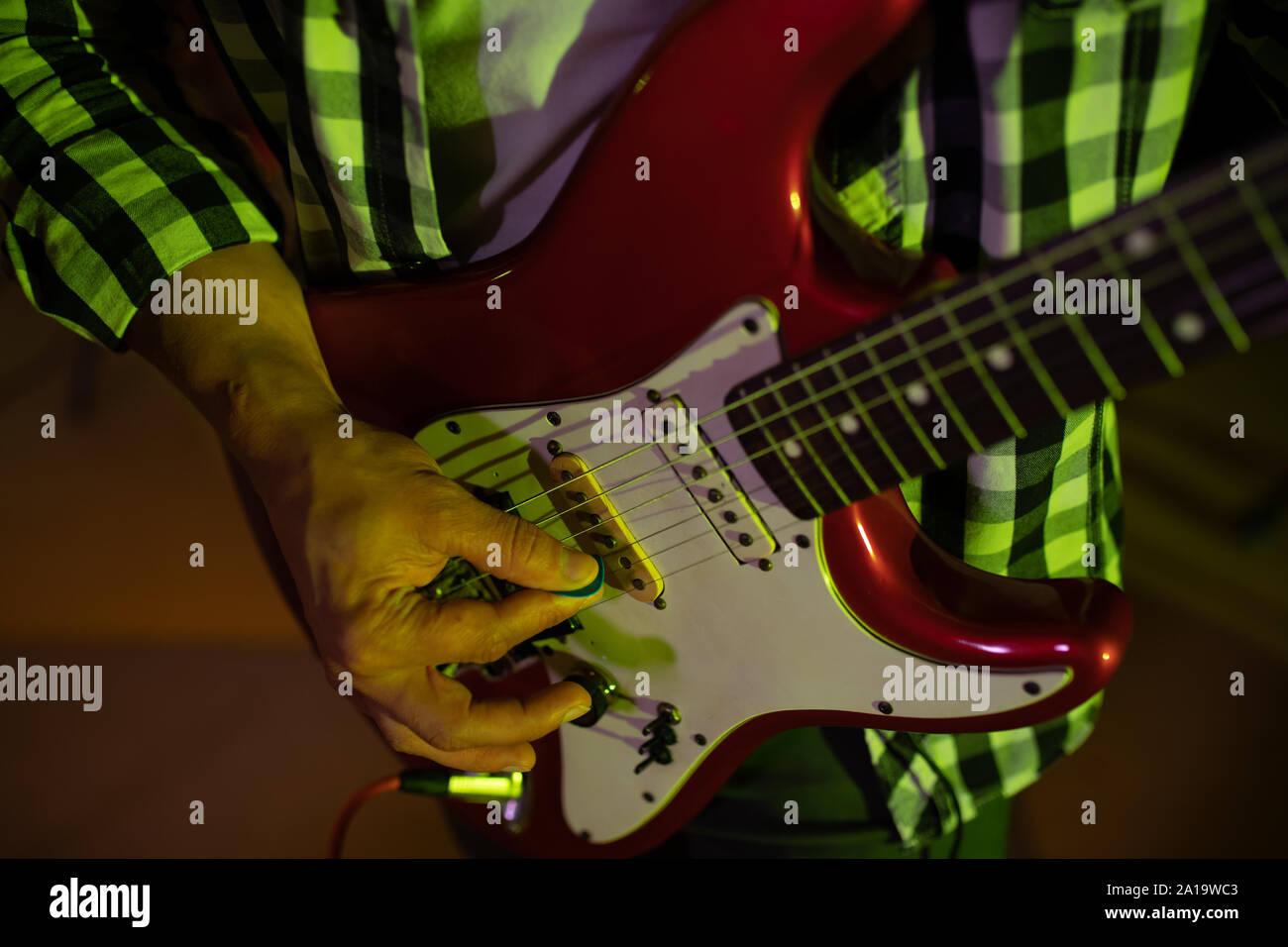 Guitarist playing in a sound studio Stock Photo - Alamy