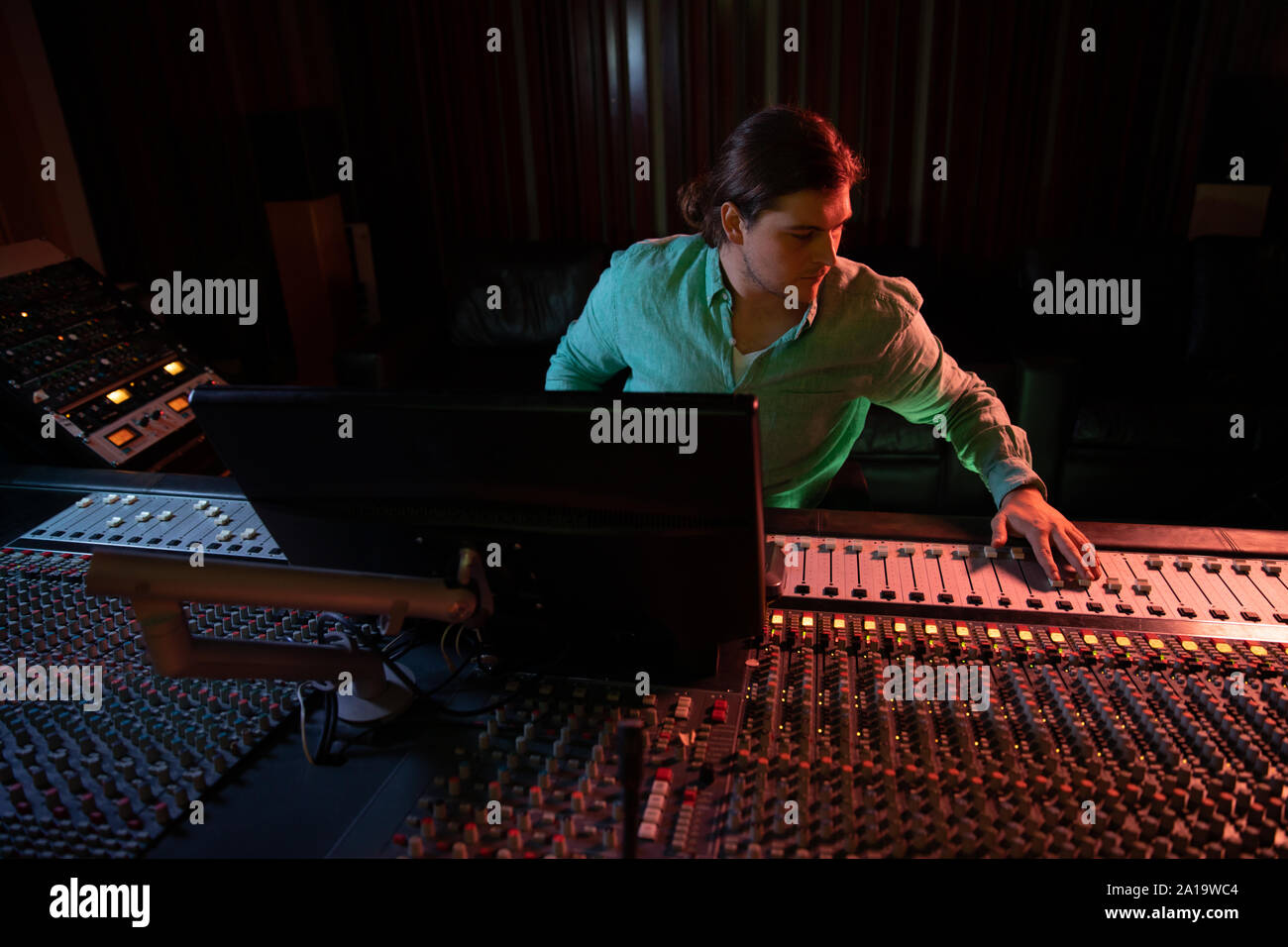 Sound engineer using mixing desk hi-res stock photography and images ...