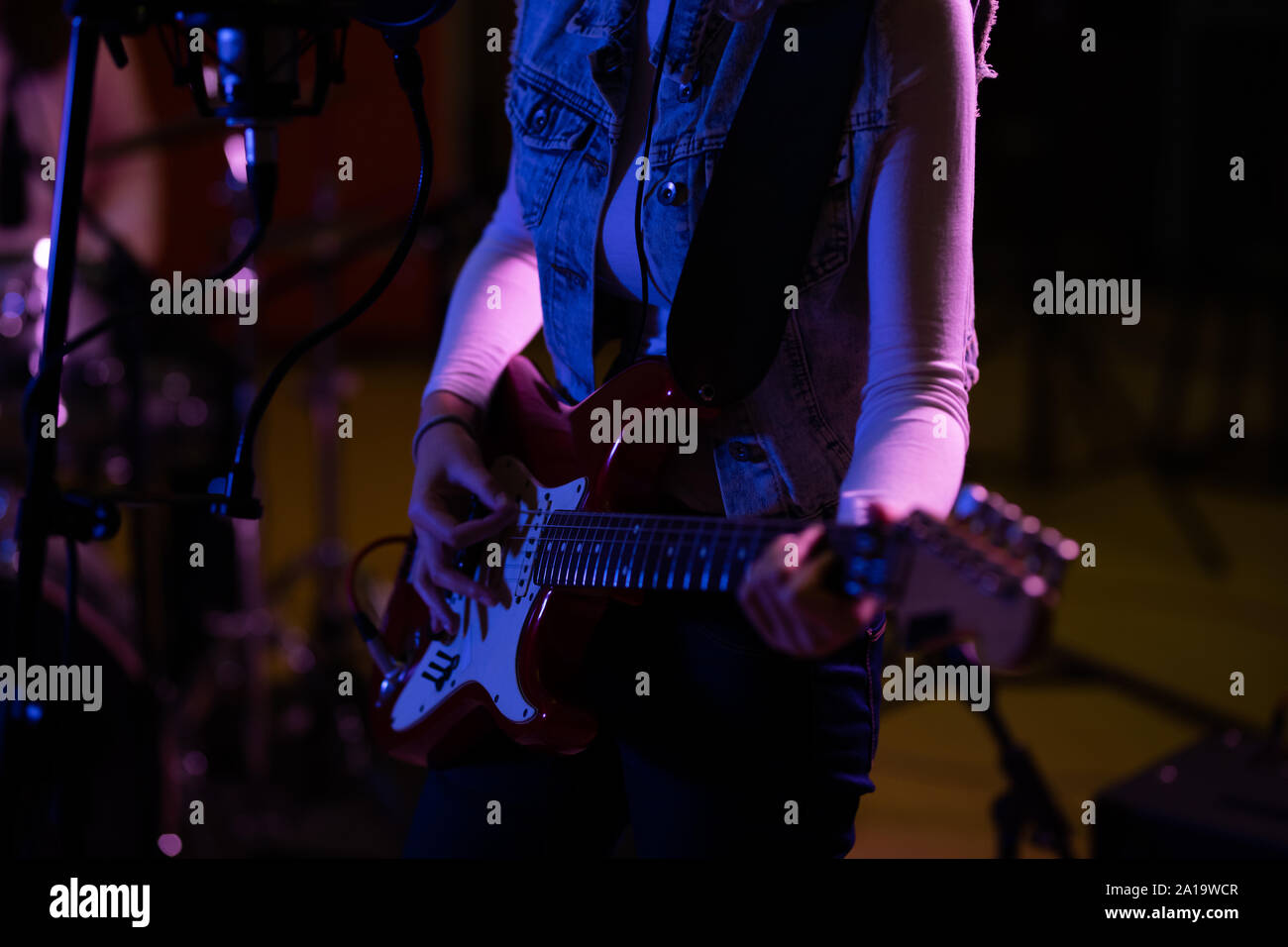 Guitarist playing in a sound studio Stock Photo - Alamy