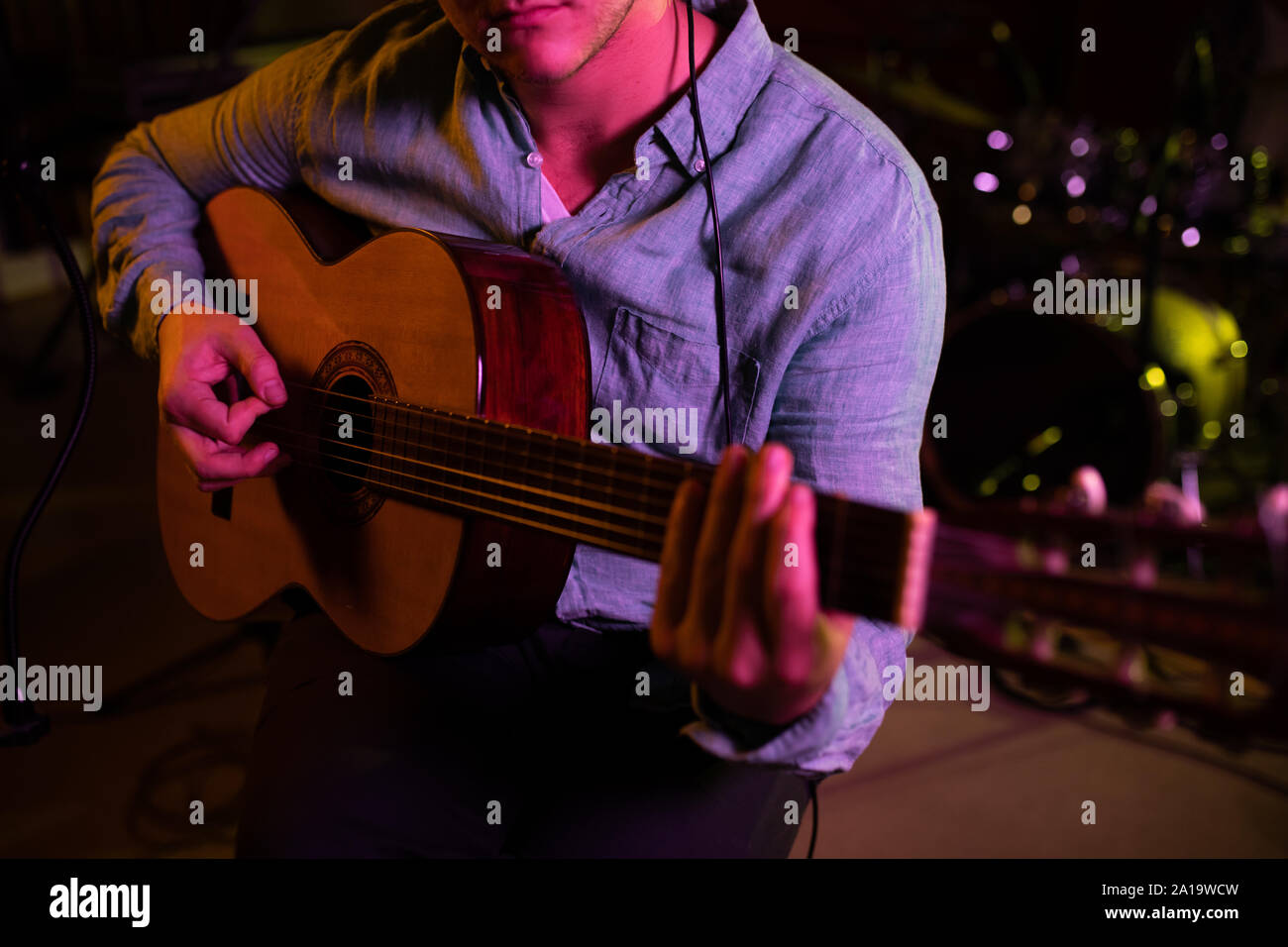 Guitarist playing in a sound studio Stock Photo - Alamy