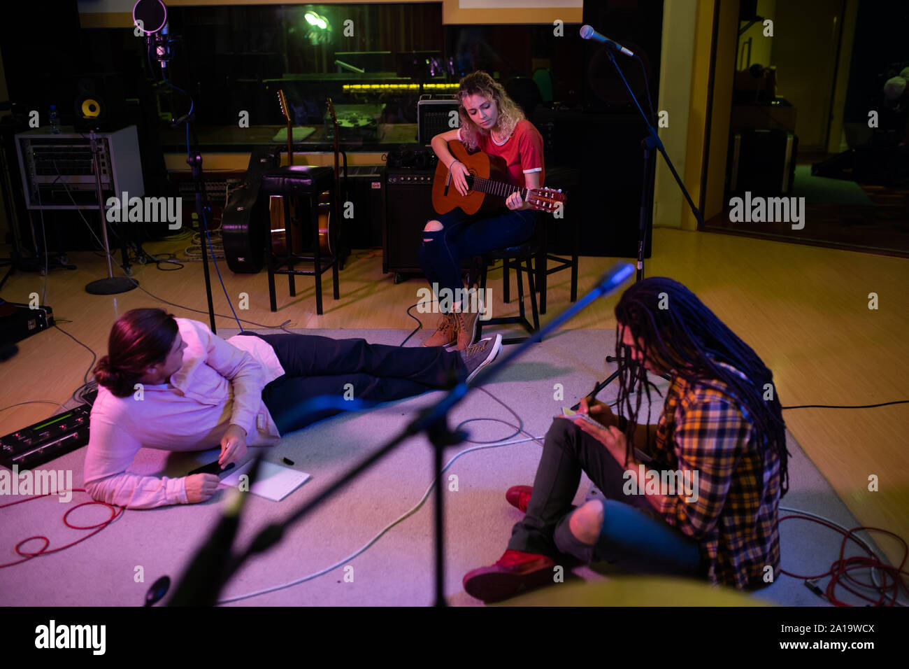 Group writing in a sound studio Stock Photo - Alamy
