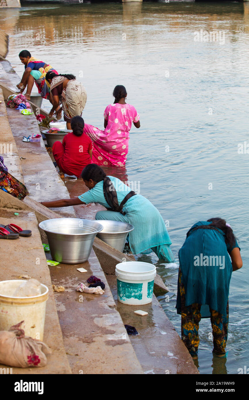 Indian womas washing clothes at Tungabhadra Canal, Hospet, Karnataka ...