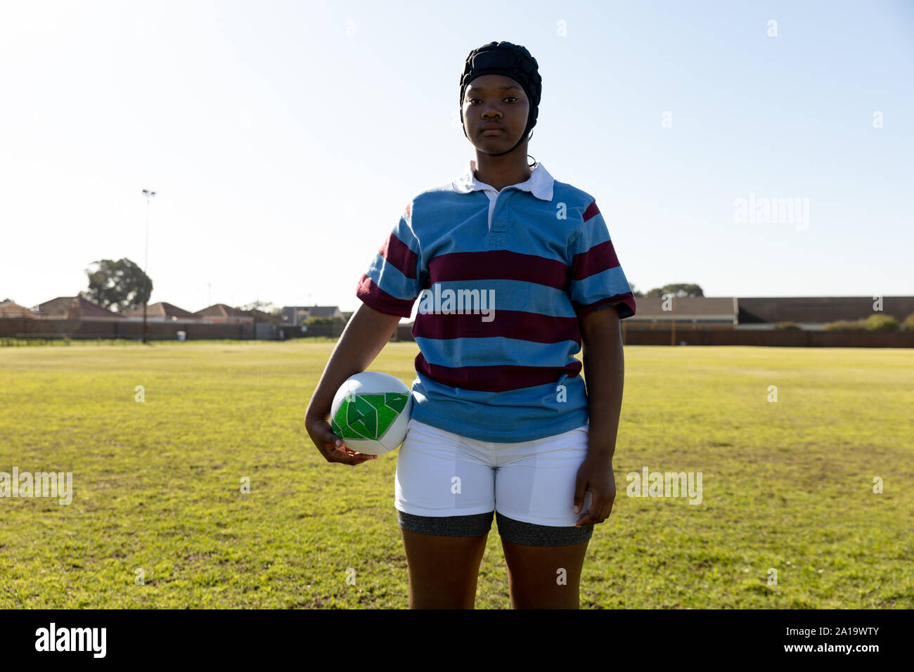 Portrait of young adult female rugby player on a rugby pitch Stock ...