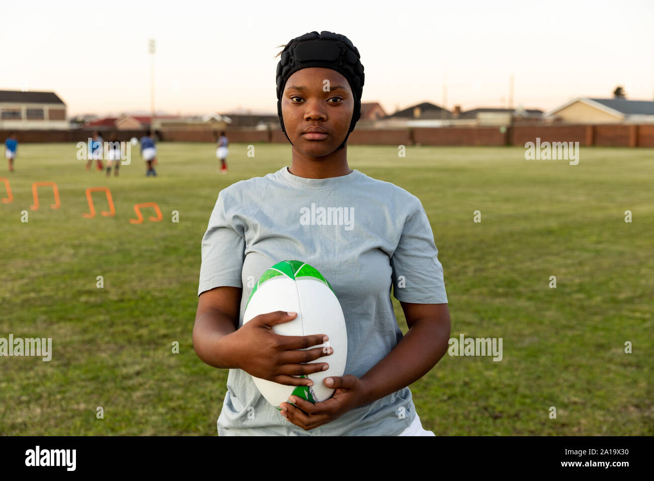 Portrait of young adult female rugby player on a rugby pitch Stock ...
