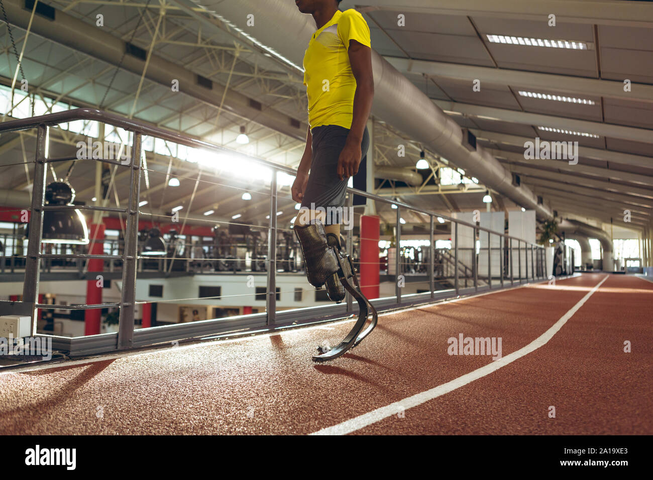 Disabled African American male athletic standing on running track in ...
