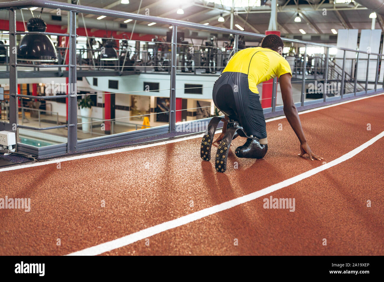 Disabled African American male athletic in starting position on running ...