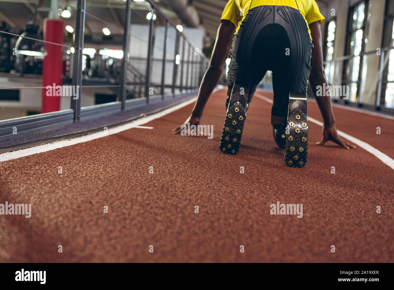 Disabled African American male athletic in starting position on running ...
