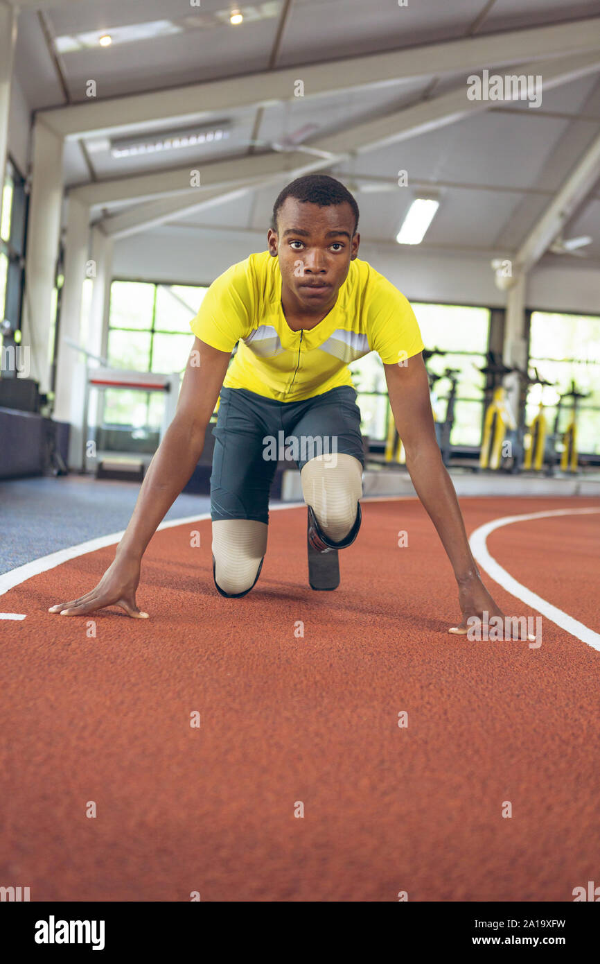 Disabled African American male athletic in starting position on running ...
