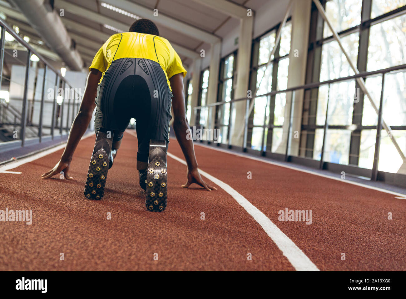 Disabled African American male athletic in starting position on running ...