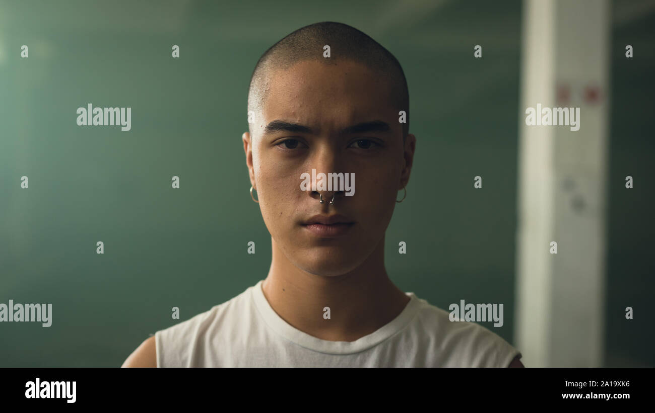 Young man inside an empty warehouse Stock Photo - Alamy