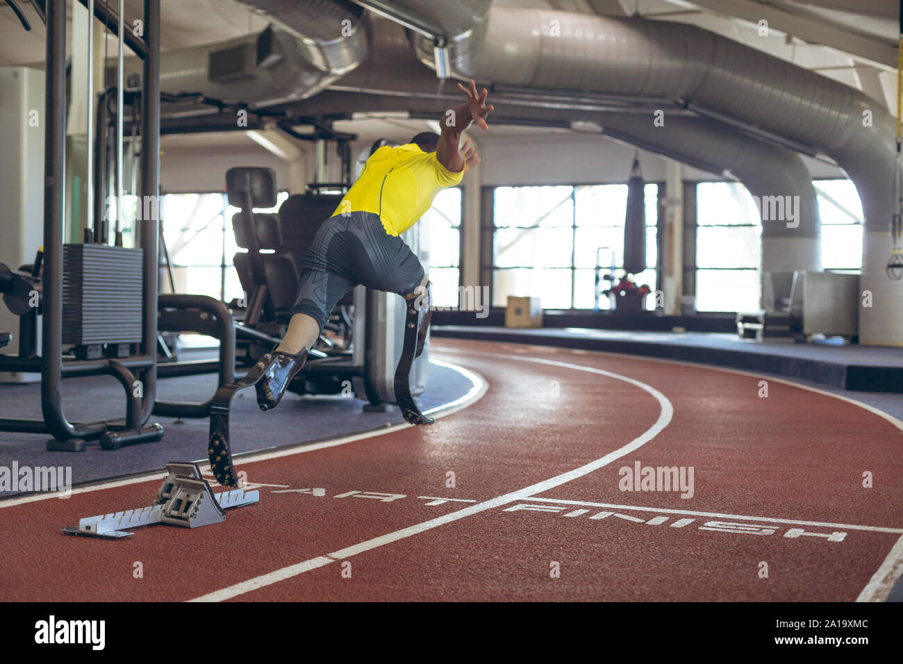 Disabled African American male athletic running on race track in ...