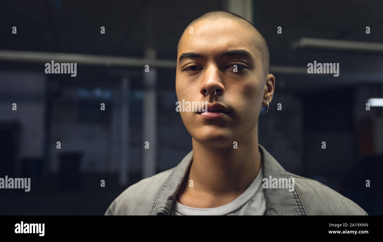 Young man inside an empty warehouse Stock Photo - Alamy
