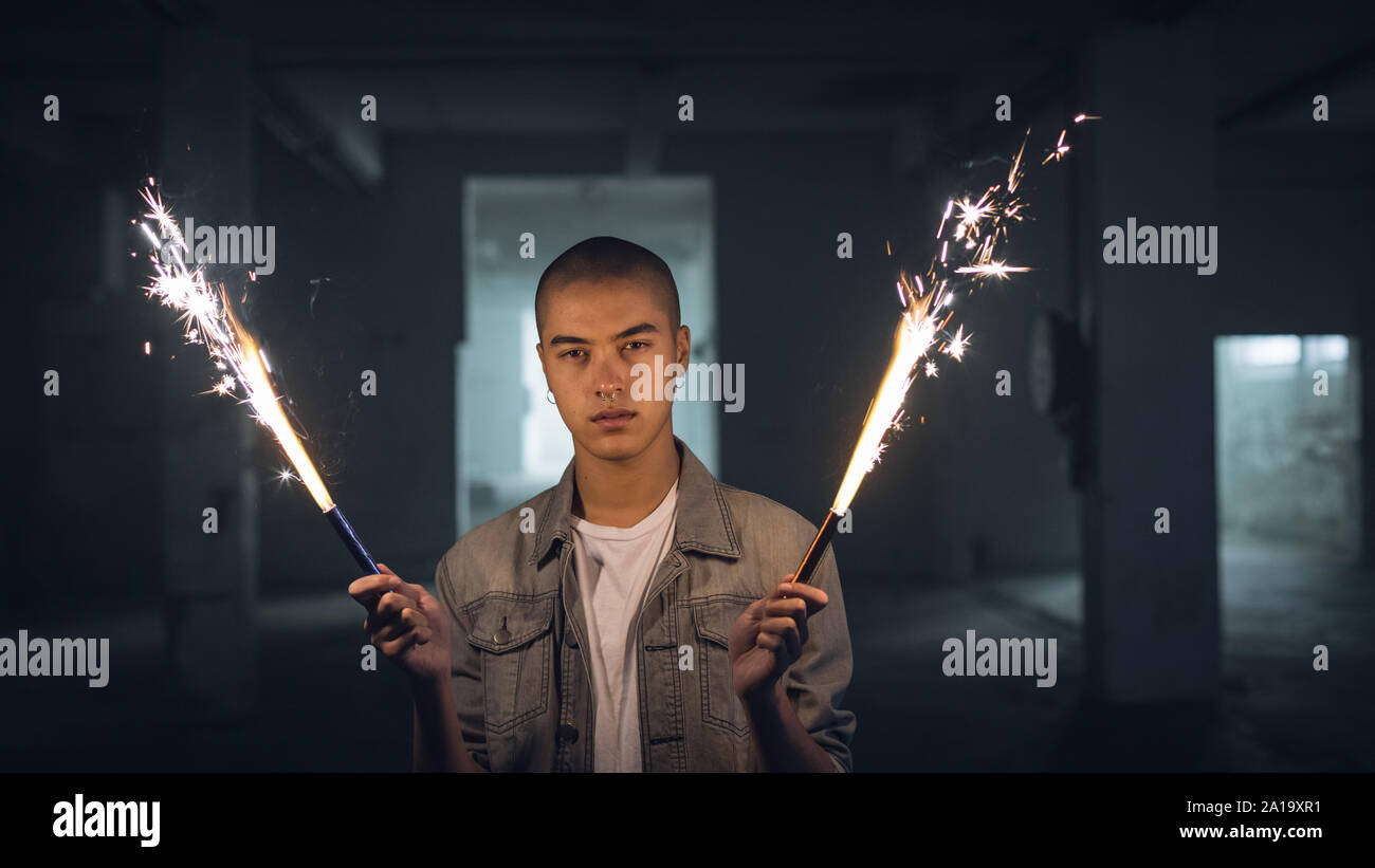 Young man inside an empty warehouse Stock Photo - Alamy