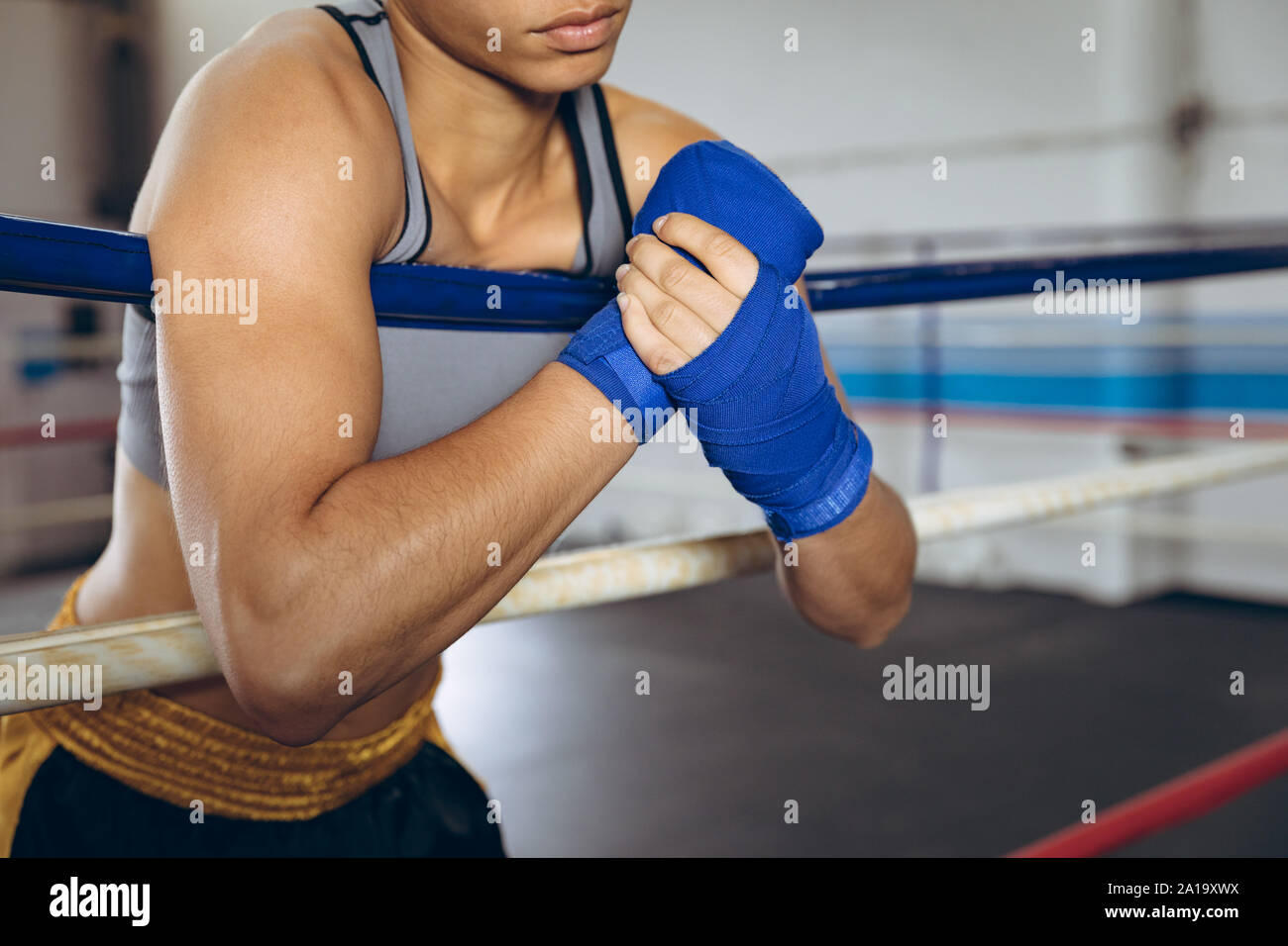 Female boxer wearing hand wrap at boxing club Stock Photo - Alamy
