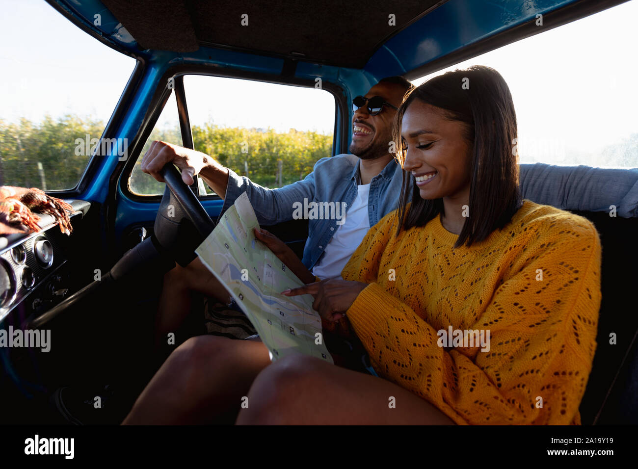 Young couple on a road trip in their pick-up truck Stock Photo - Alamy
