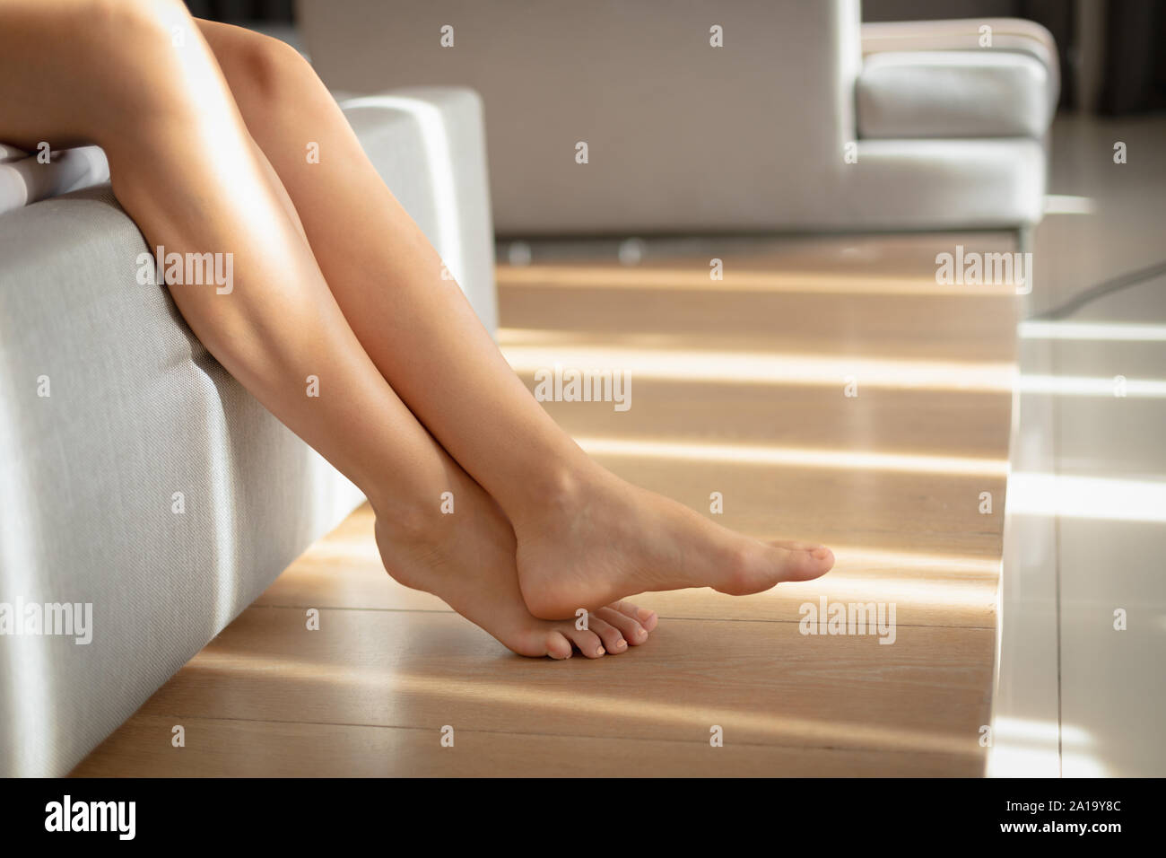 Woman legs beautiful sitting hi-res stock photography and images - Alamy