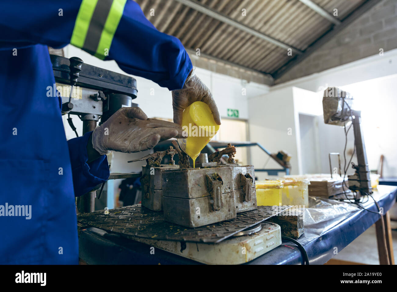 Man working in a sports equipment factory Stock Photo - Alamy