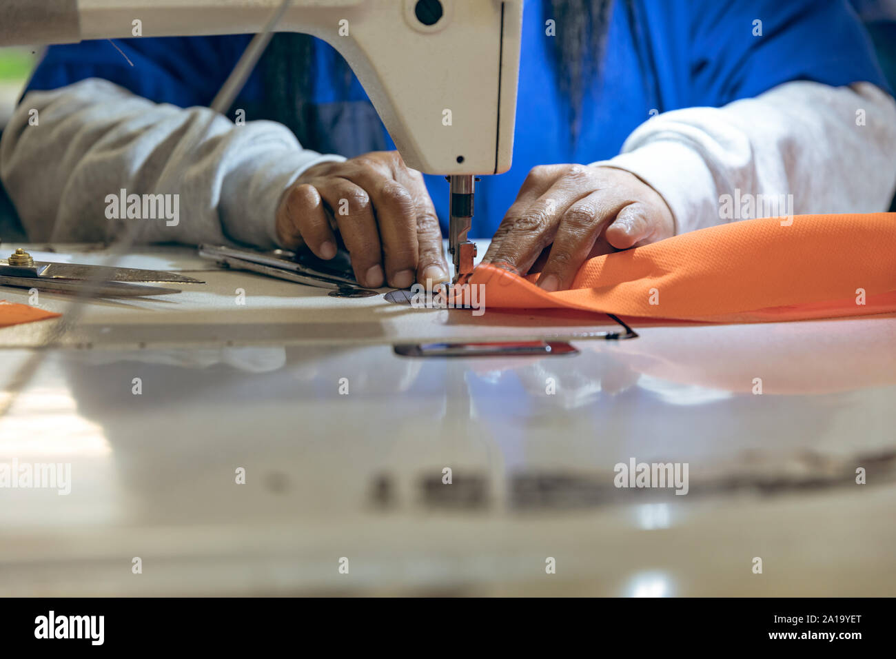 Woman factory worker operating machine hi-res stock photography and ...