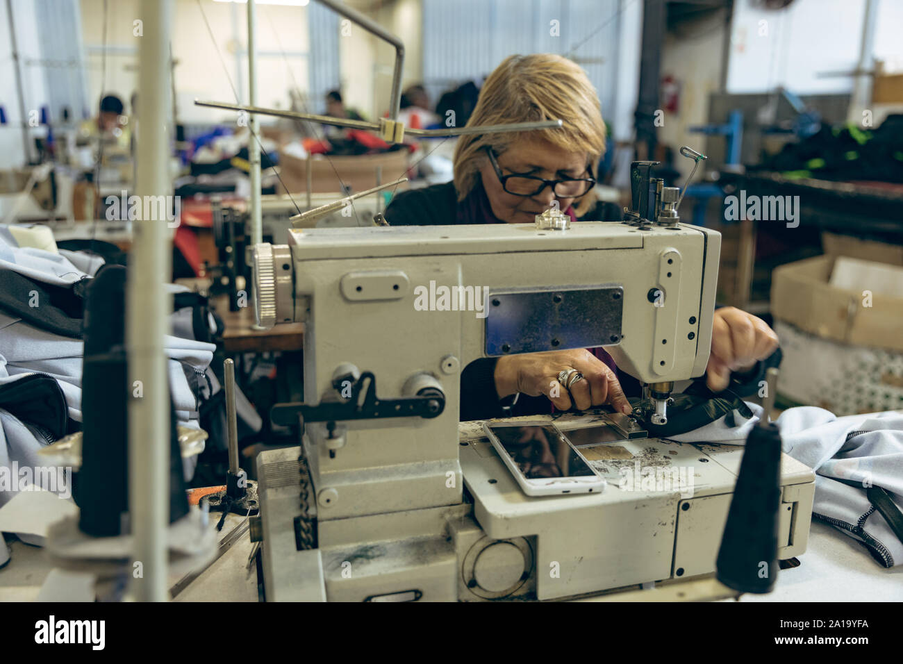 Woman working in textile factory hi-res stock photography and images ...