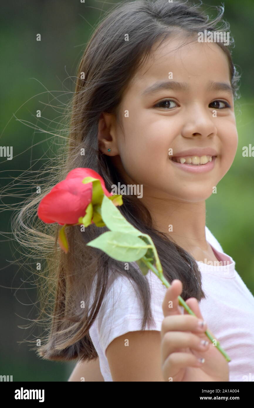 Smiling Cute Diverse Female With A Rose Stock Photo - Alamy