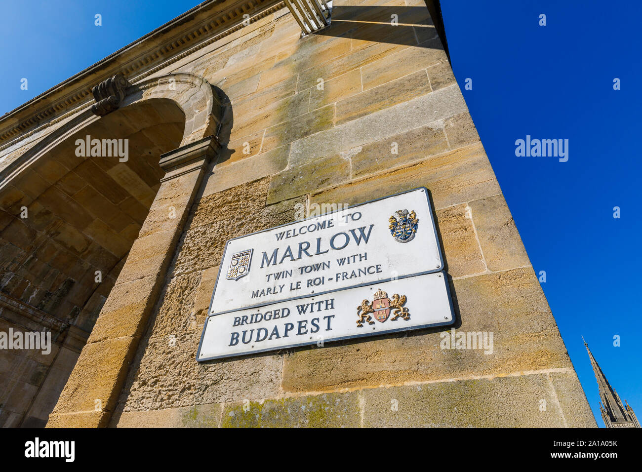 Welcome name plaque on a Marlow suspension bridge tower over the River ...