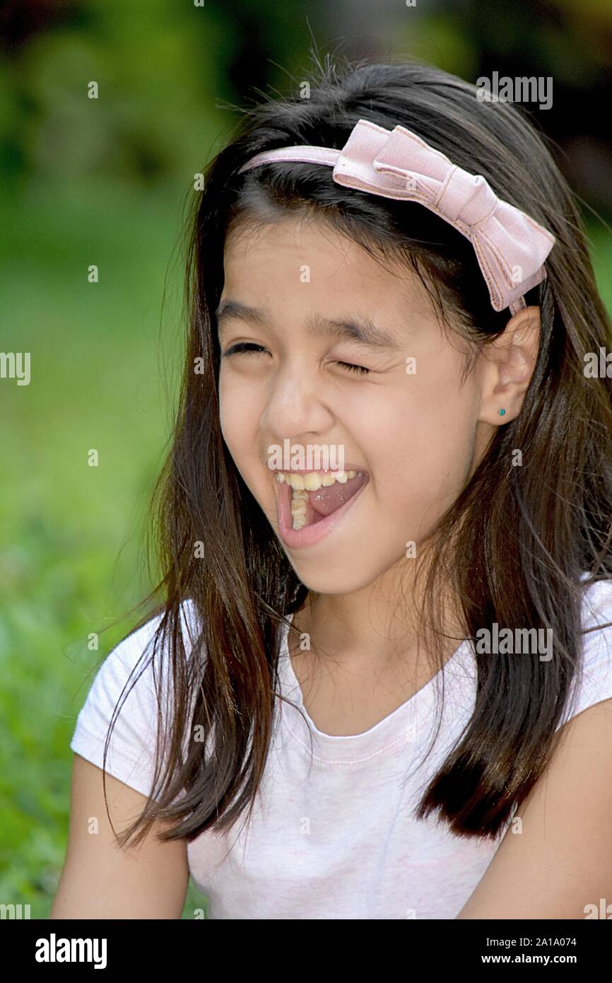 A Diverse Girl Winking Stock Photo - Alamy