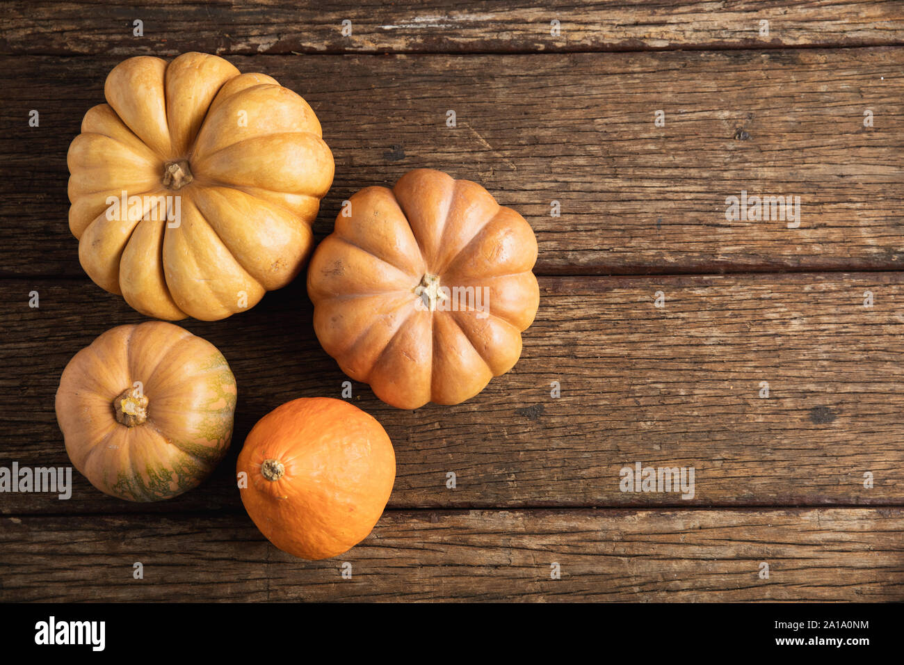 Autumn flat lay from above, wooden table top with pumpkins Stock Photo ...