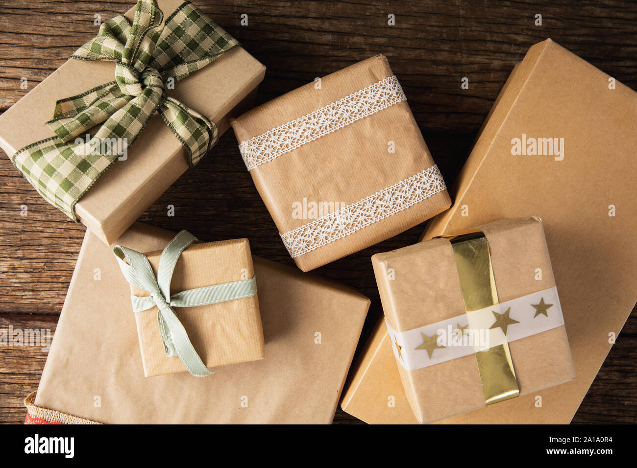 Simple wrapped gift on wooden table Stock Photo - Alamy