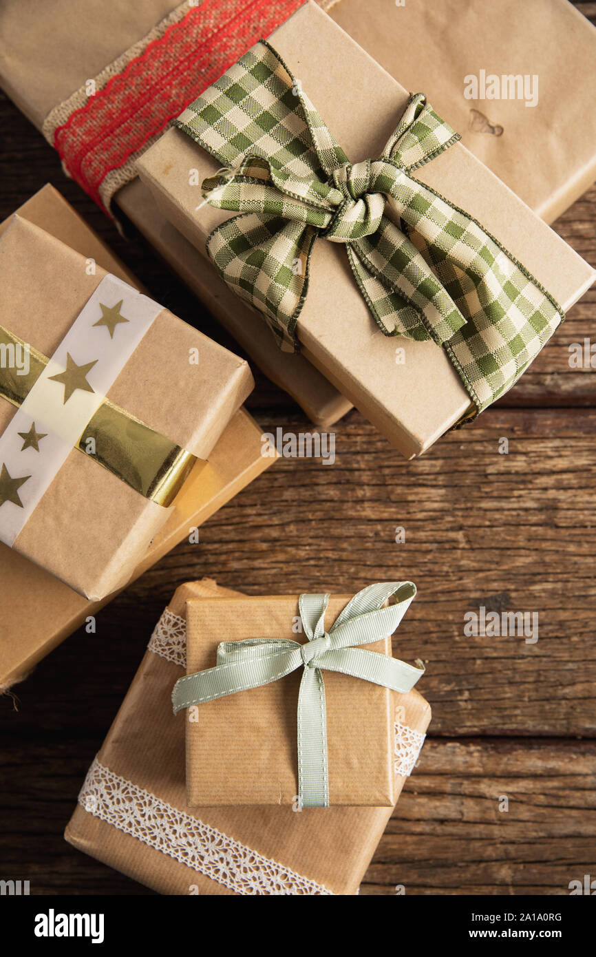 Simple wrapped gift on wooden table Stock Photo - Alamy