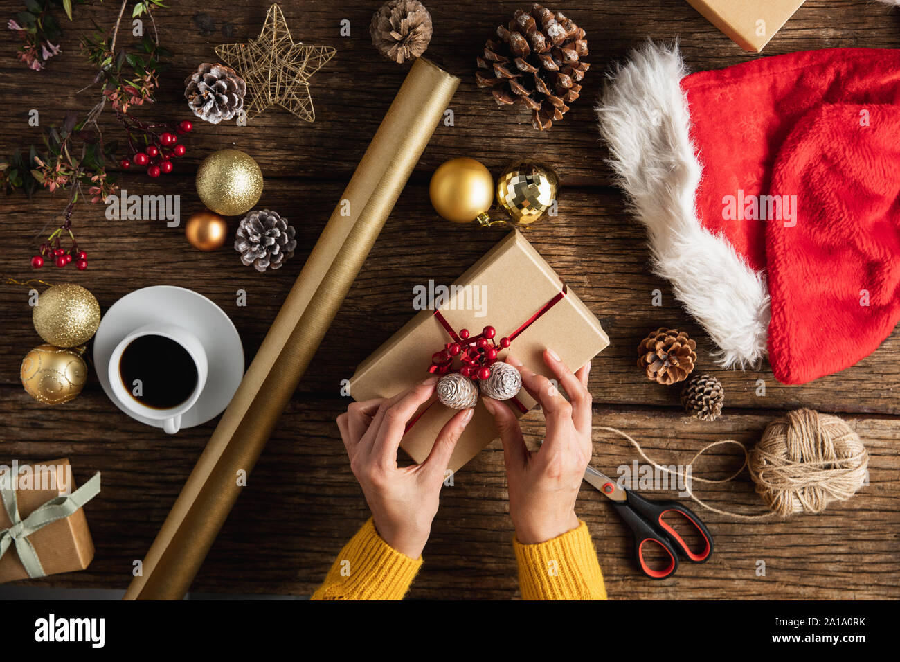 Hands wrapping christmas gifts Stock Photo - Alamy