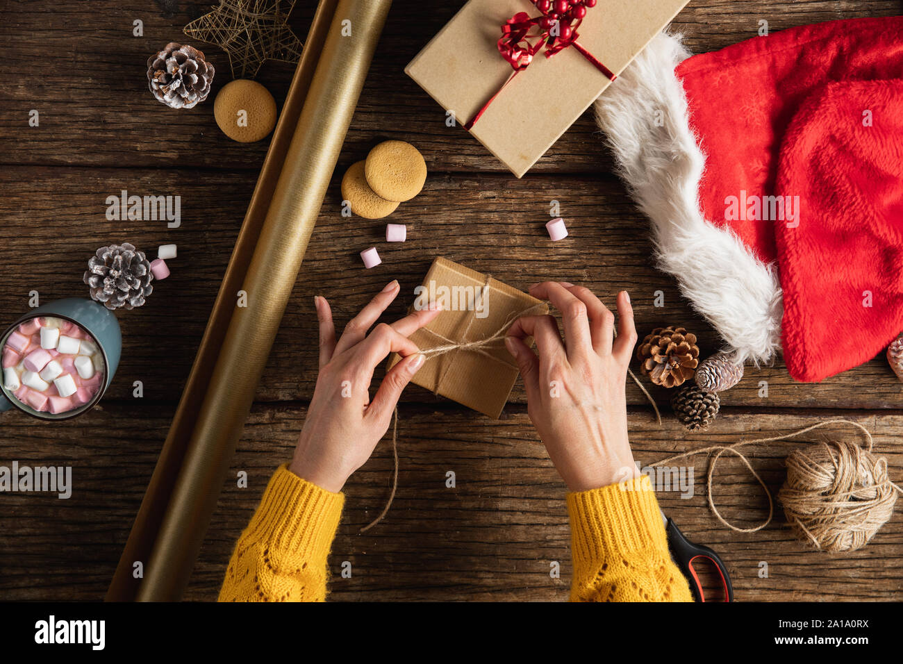 Wrapping hands hi-res stock photography and images - Alamy