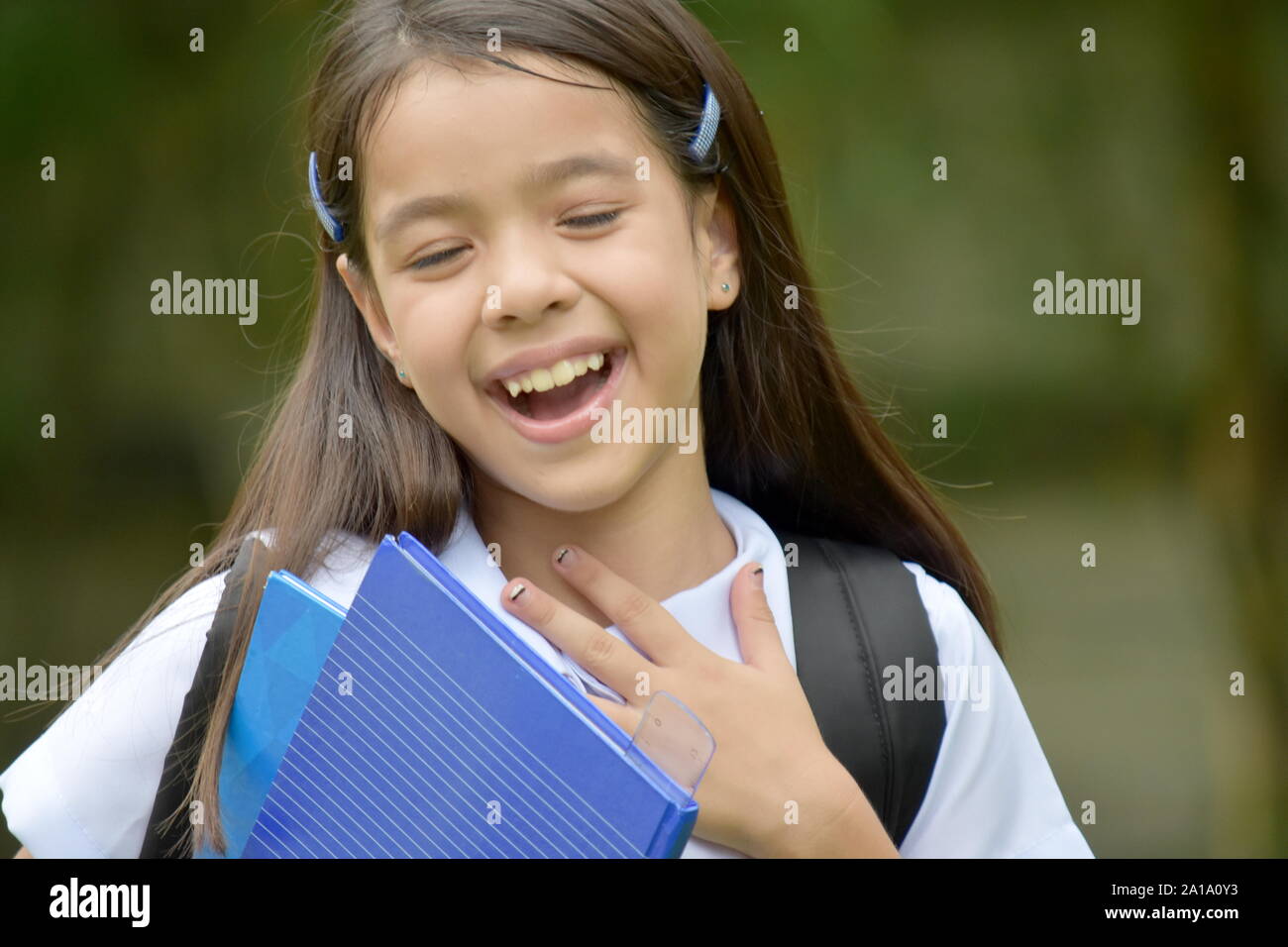 An Appreciative Female Student Wearing Uniform Stock Photo - Alamy