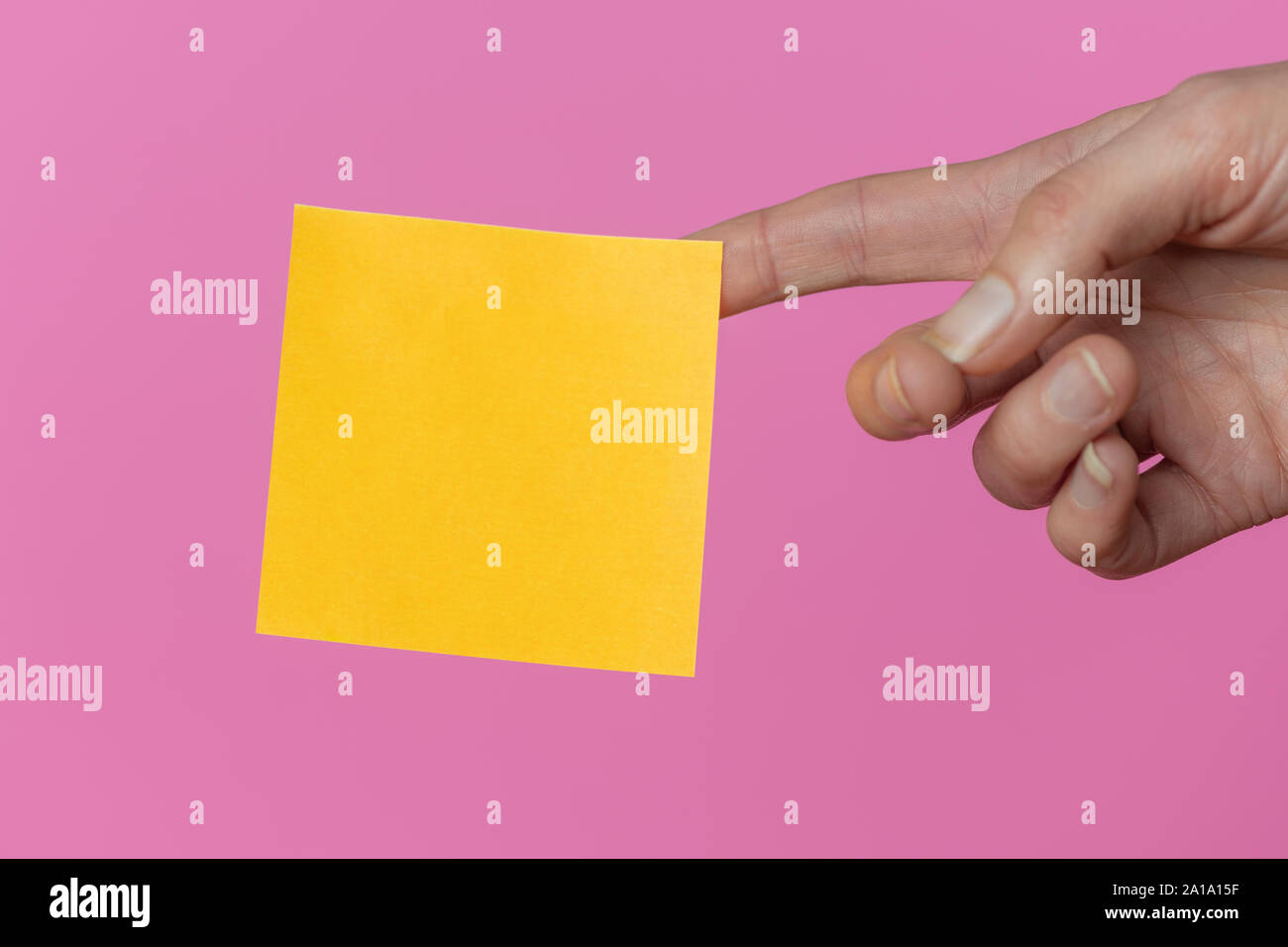 Yellow post it note stuck to a hand, blank Stock Photo - Alamy