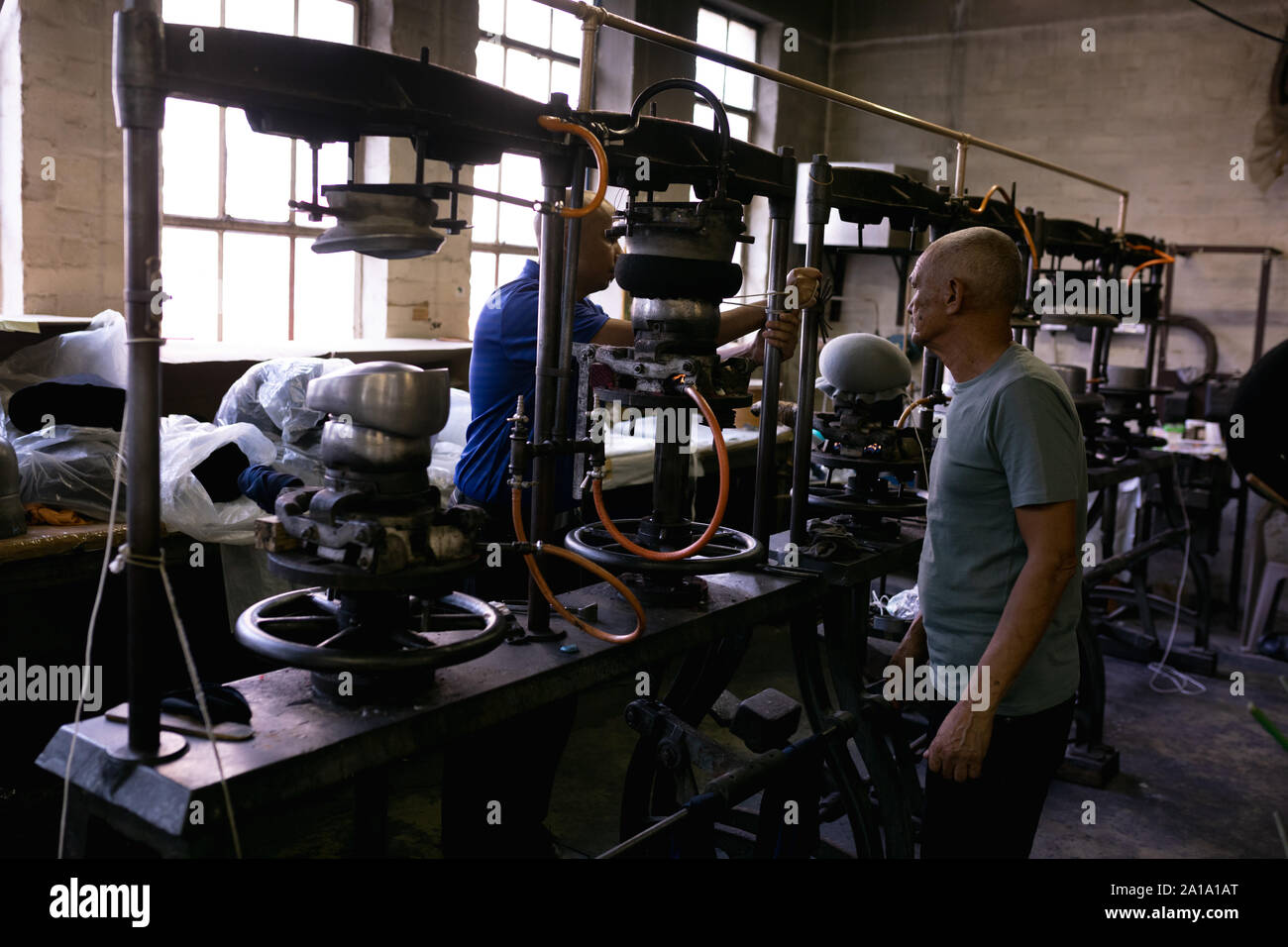 Men work factory hi-res stock photography and images - Alamy