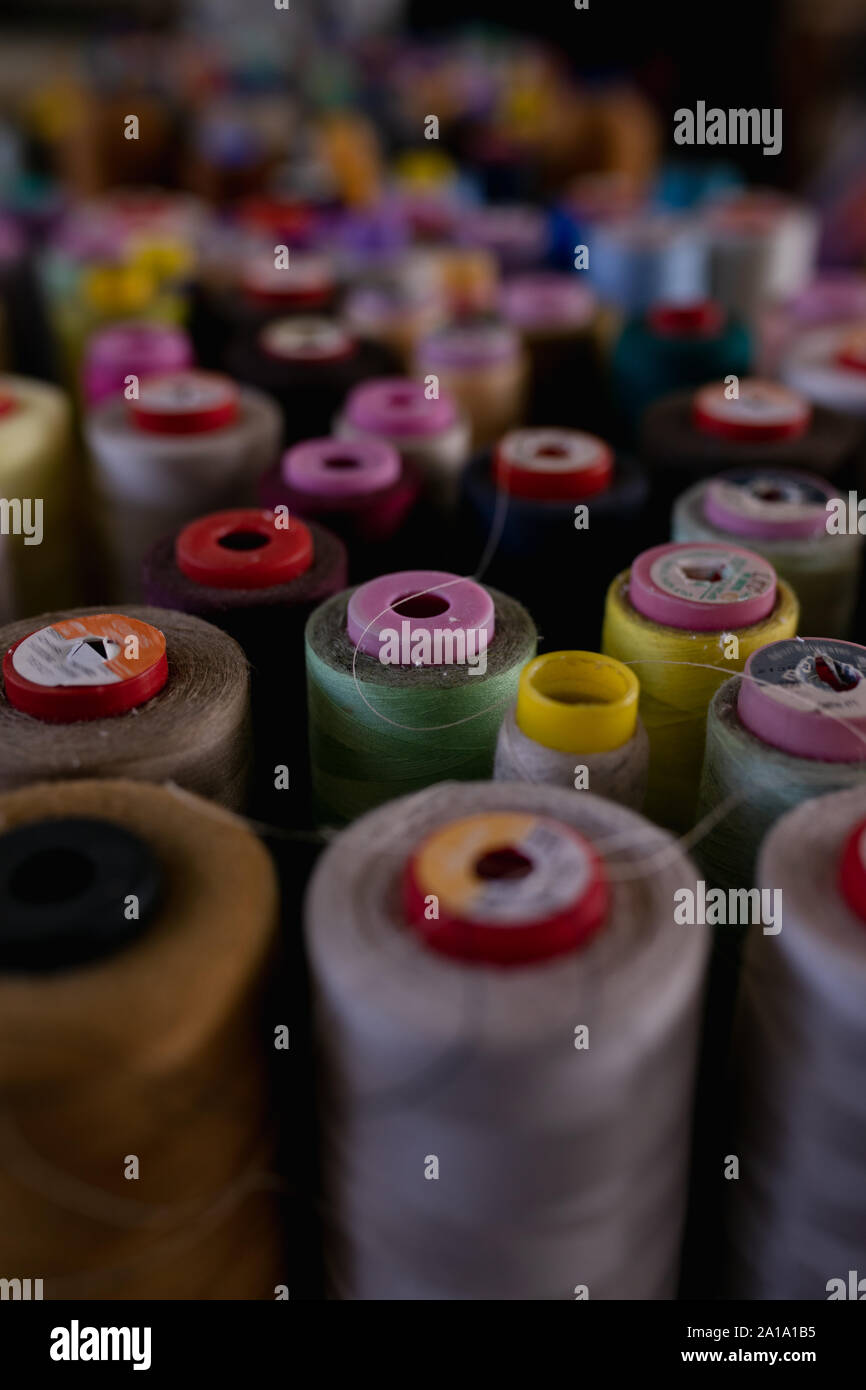 Spools of thread in a hat factory Stock Photo - Alamy