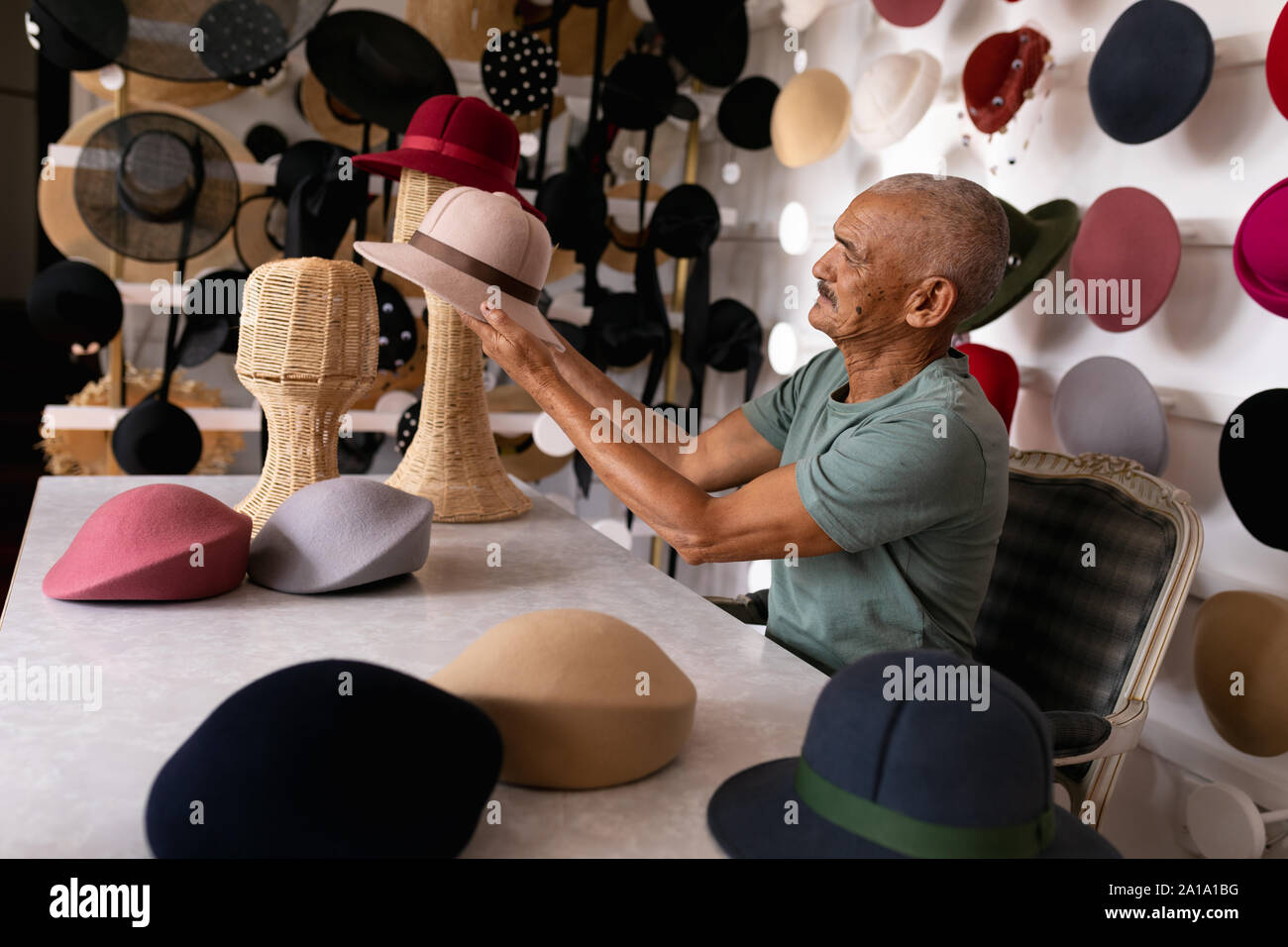 Inspecting hat hi-res stock photography and images - Alamy