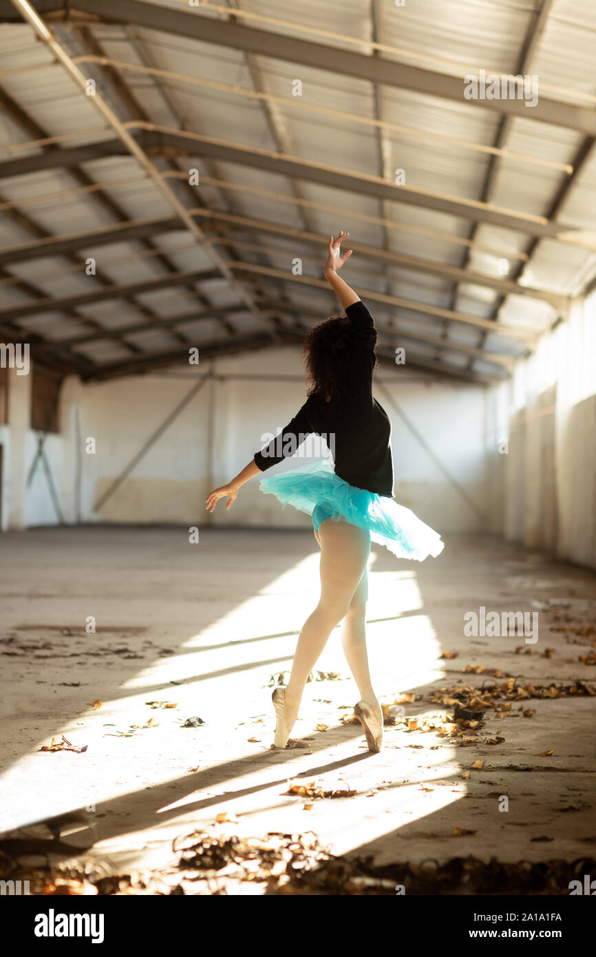 Female dancer in an empty warehouse Stock Photo - Alamy