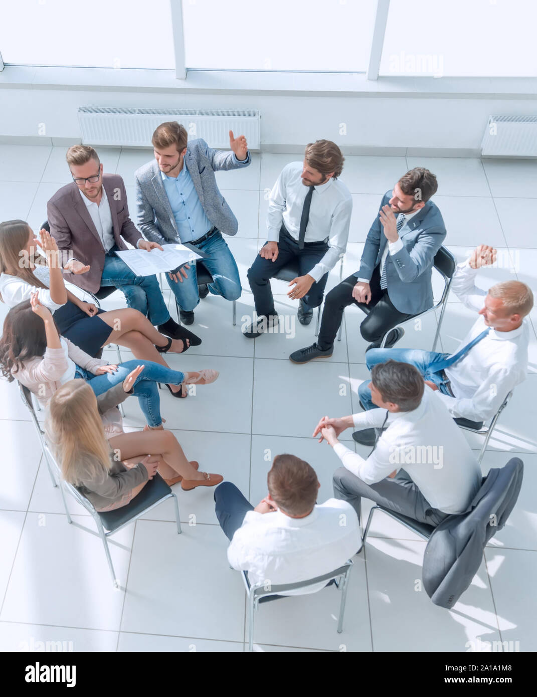 young employees ask questions during business training Stock Photo - Alamy