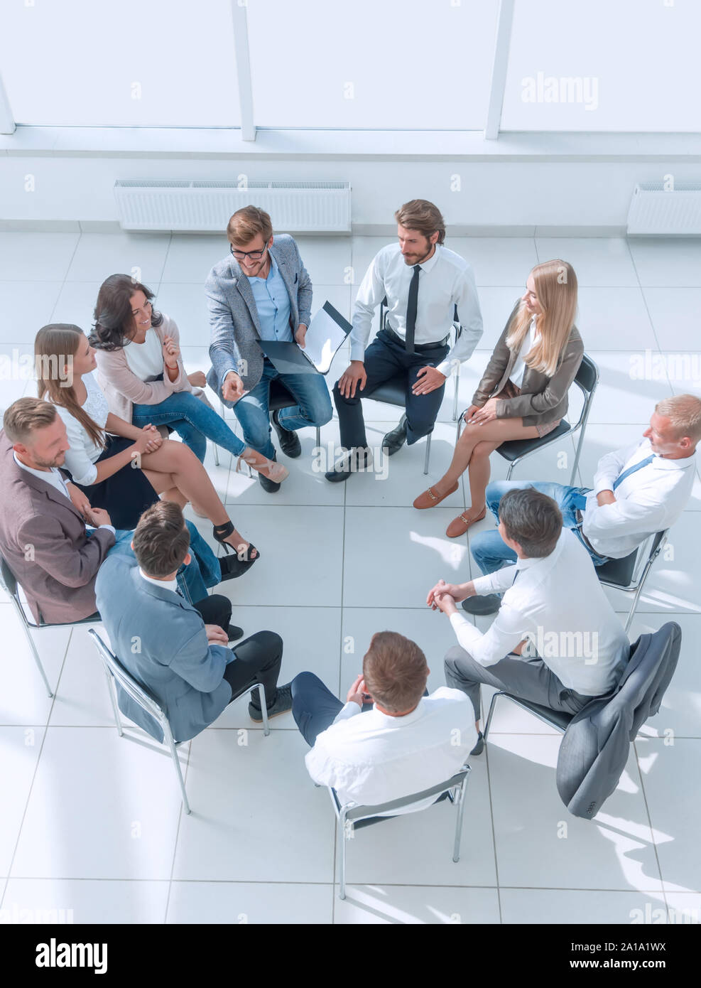young employees ask questions during business training Stock Photo - Alamy
