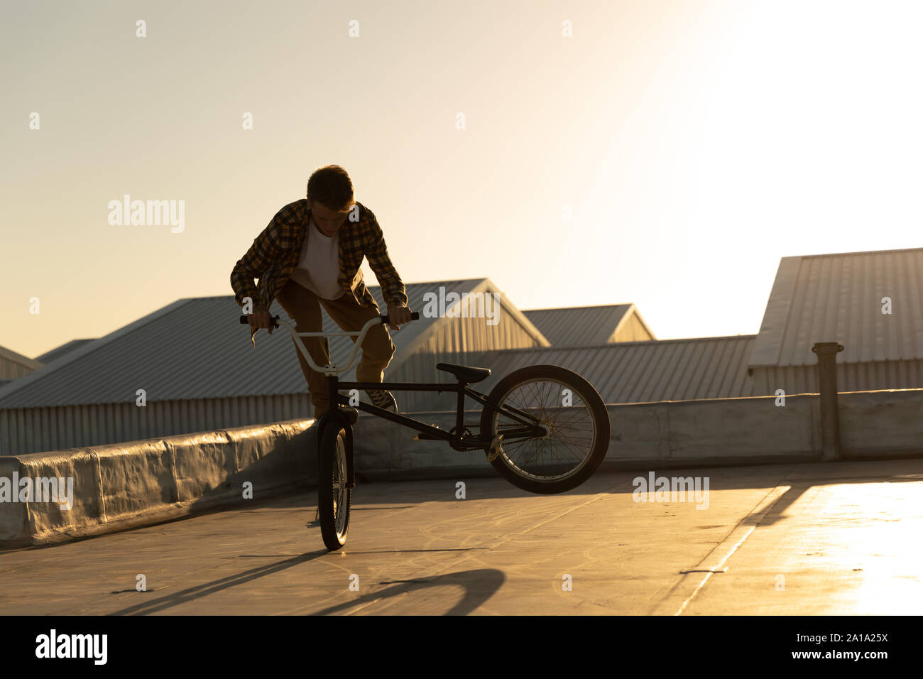 BMX rider on a rooftop Stock Photo - Alamy