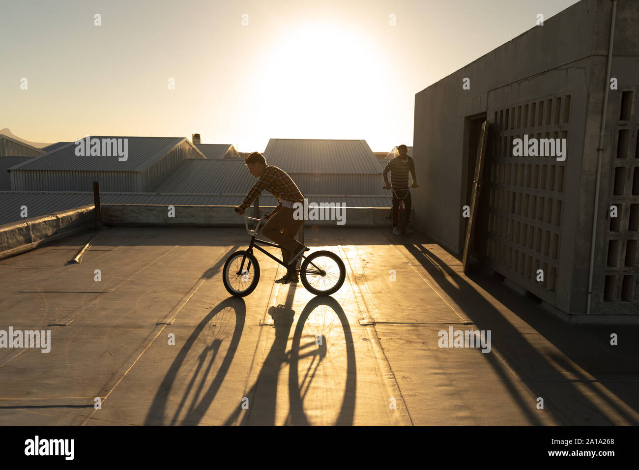 BMX riders on a rooftop Stock Photo - Alamy